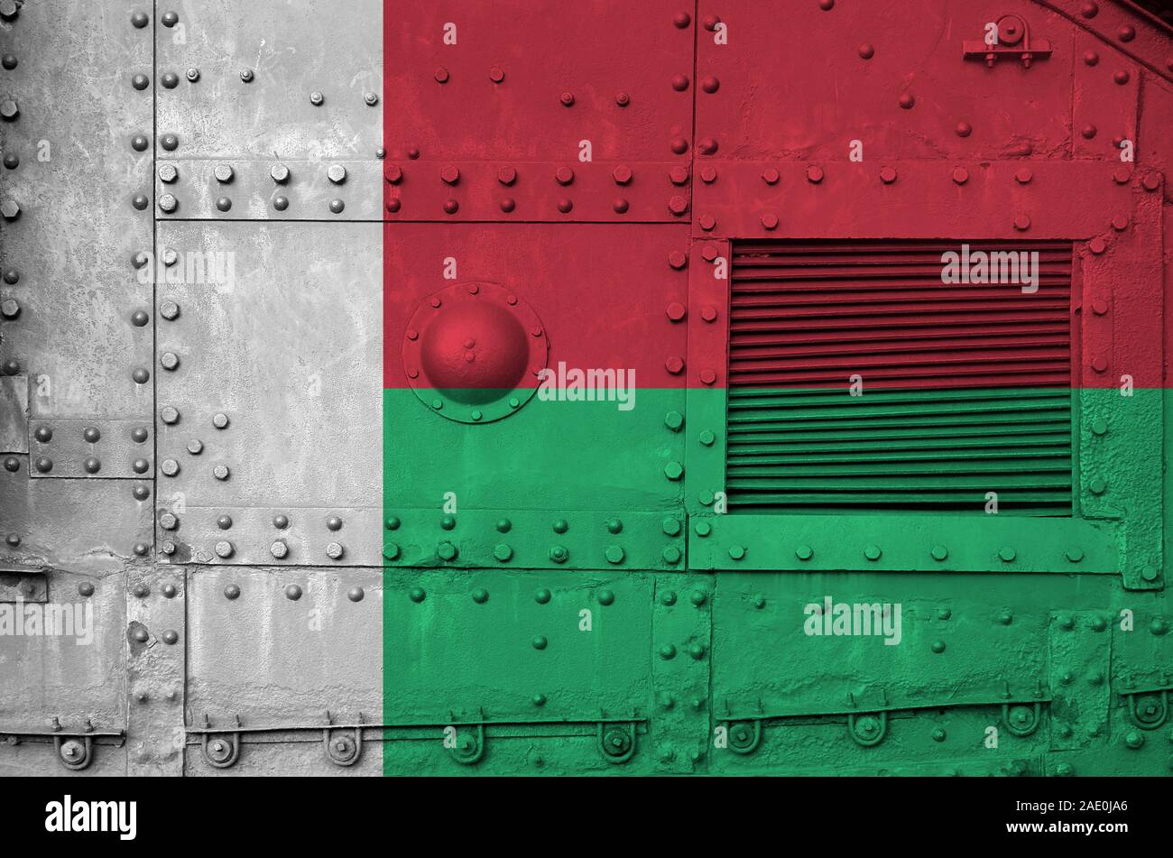 Madagascar flag depicted on side part of military armored tank close up ...