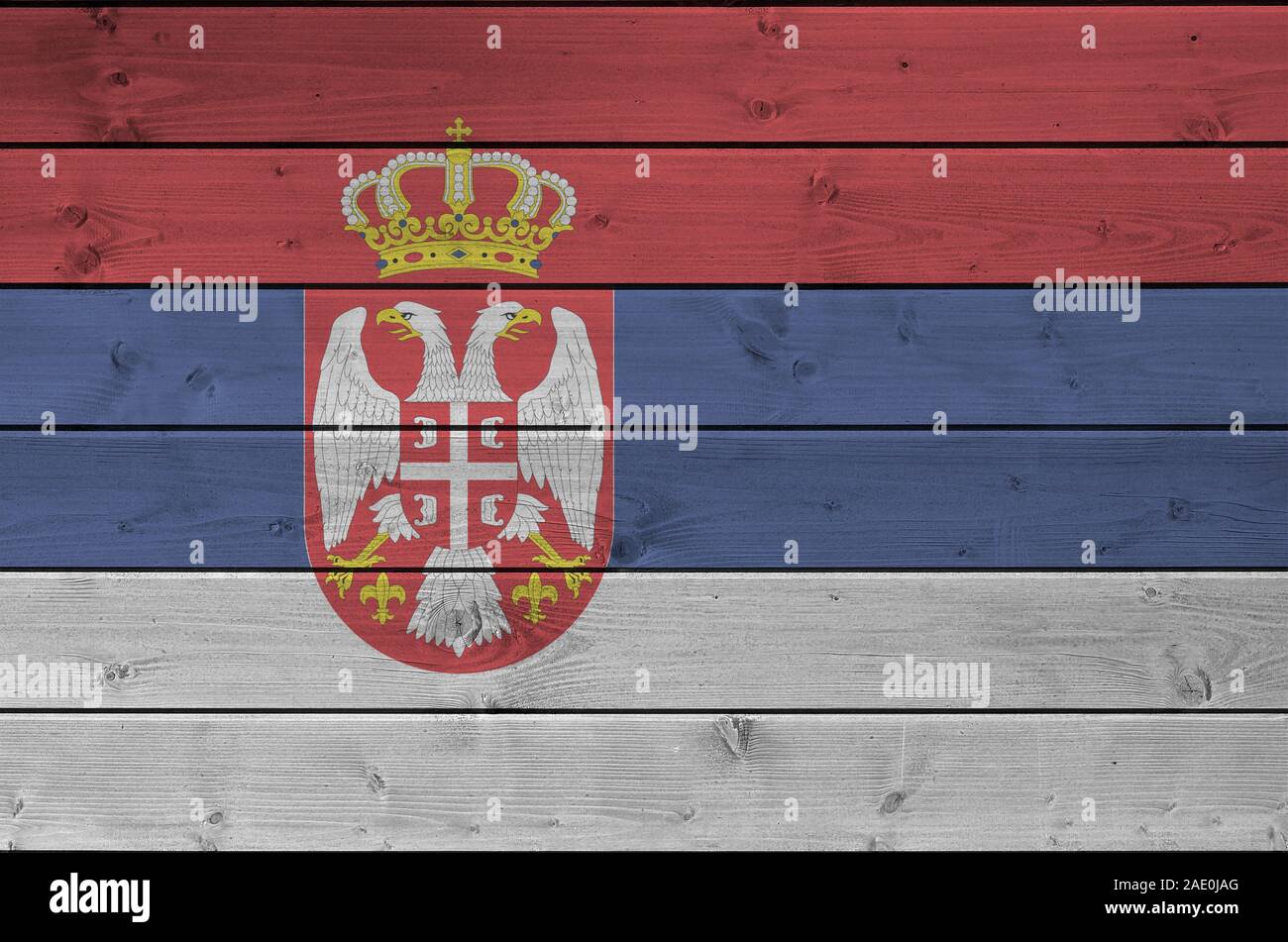 Serbia flag depicted in bright paint colors on old wooden wall close up ...