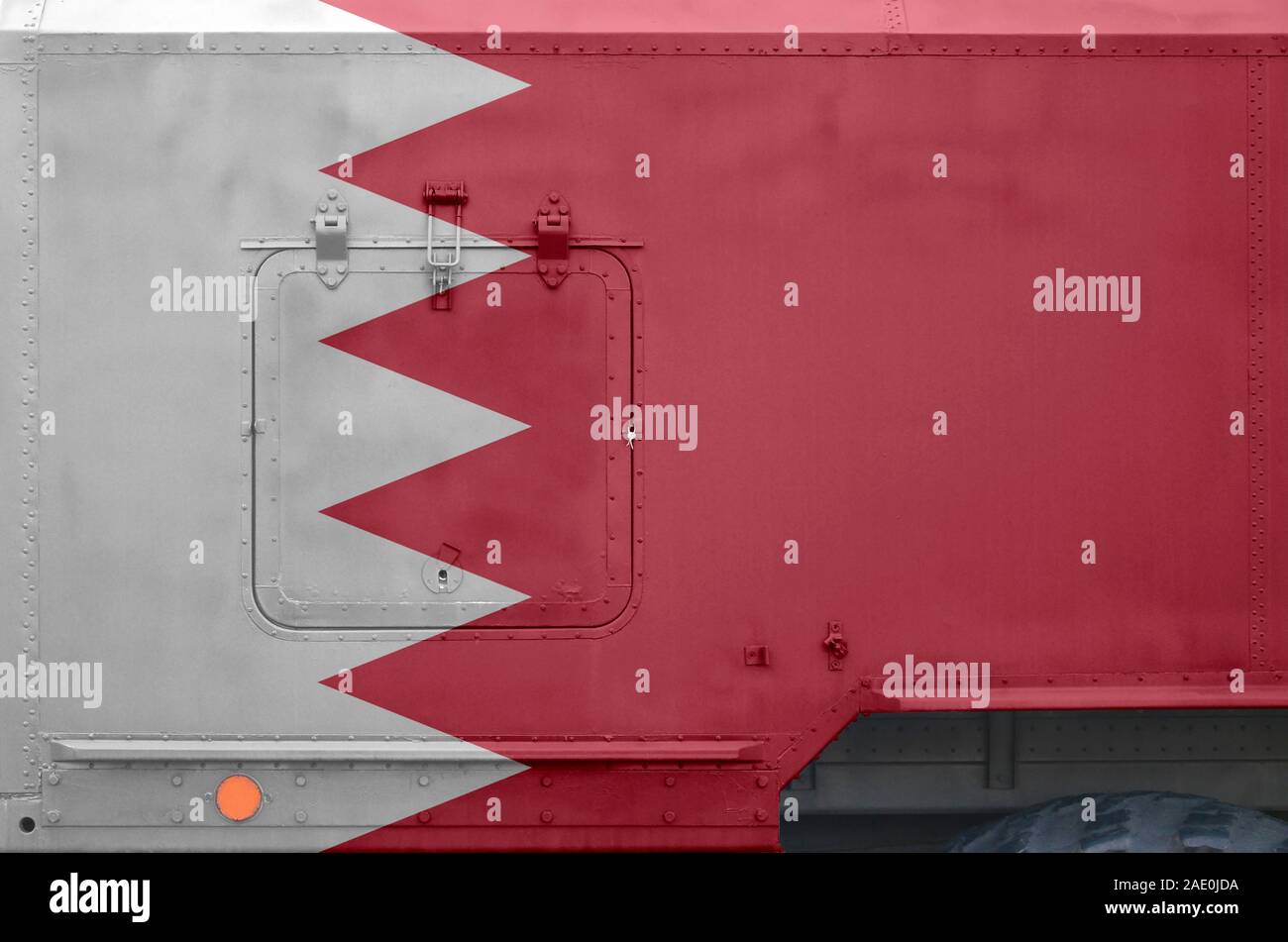 Bahrain flag depicted on side part of military armored truck close up ...