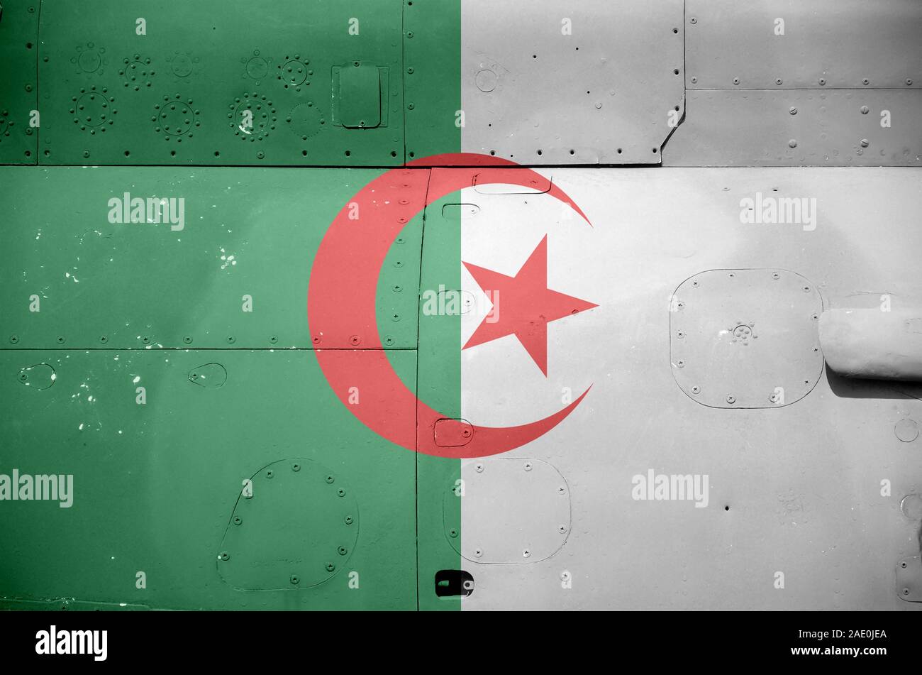 Algeria flag depicted on side part of military armored helicopter close ...