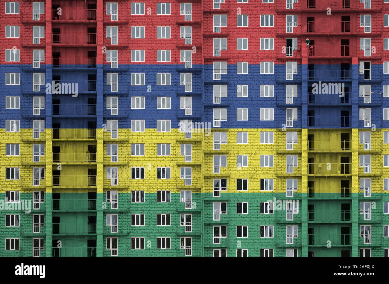 Mauritius flag depicted in paint colors on multi-storey residental ...