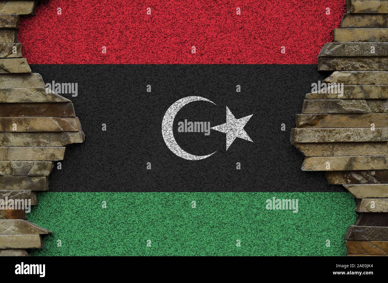 Libya flag depicted in paint colors on old stone wall close up ...