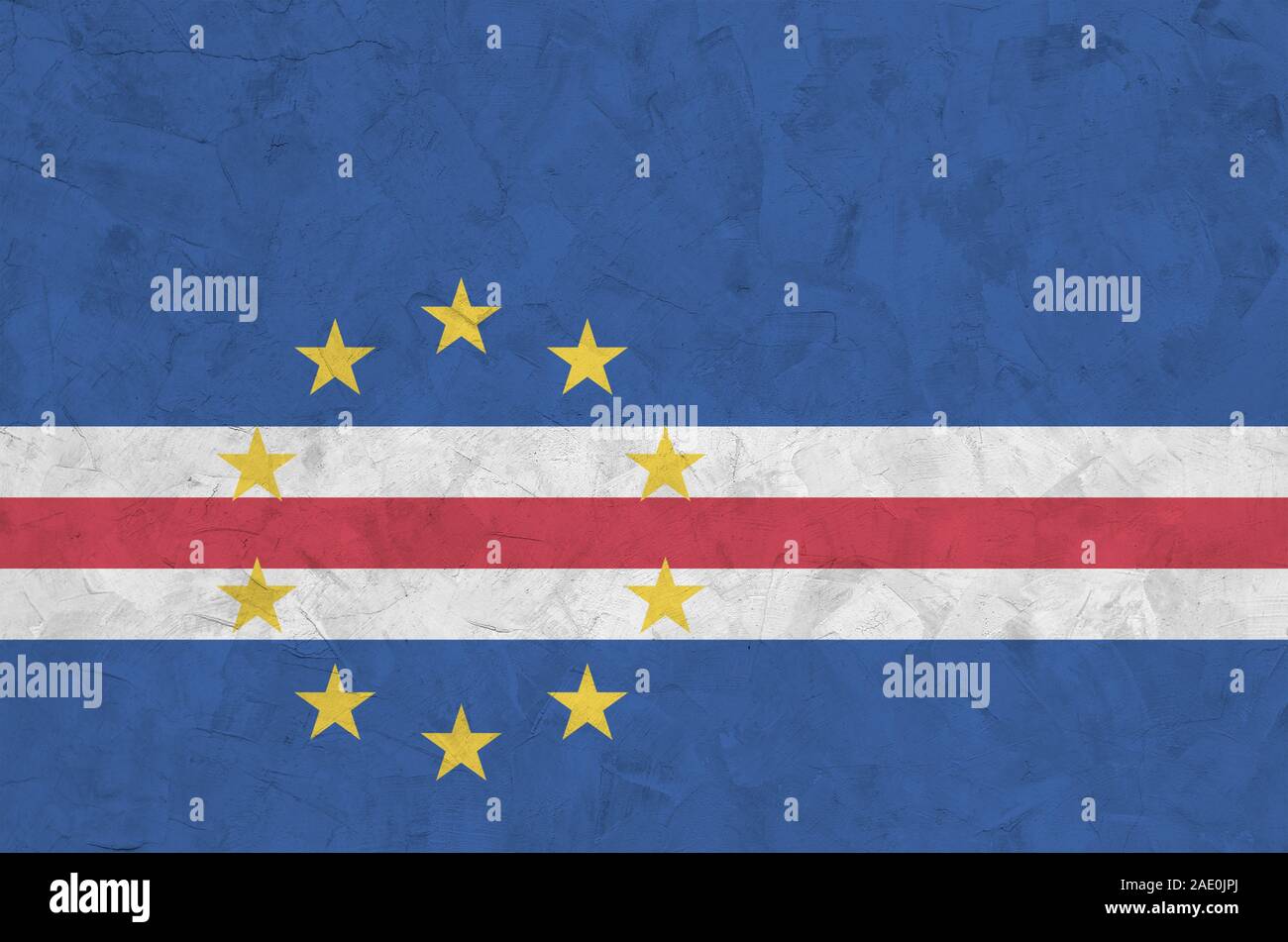 Cabo verde flag depicted in bright paint colors on old relief ...