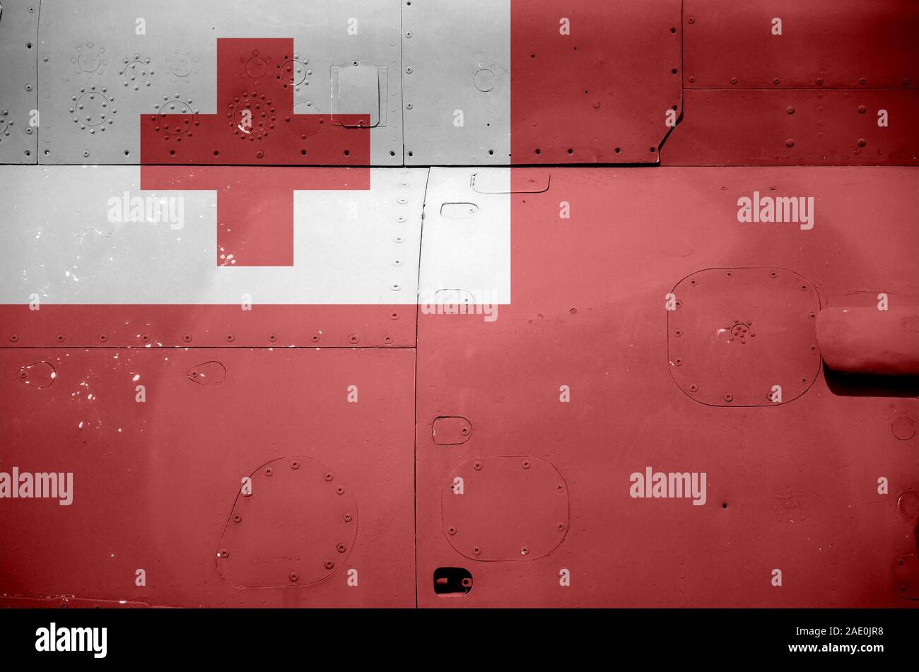 Tonga flag depicted on side part of military armored helicopter close ...