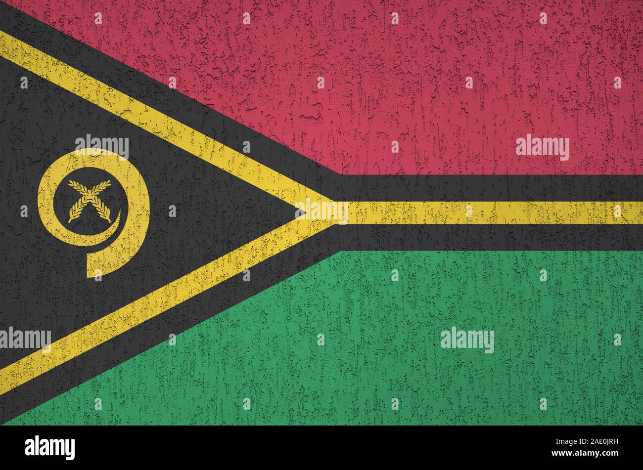 Vanuatu flag depicted in bright paint colors on old relief plastering ...