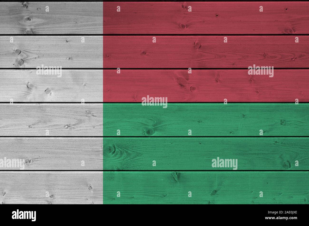 Madagascar flag depicted in bright paint colors on old wooden wall ...