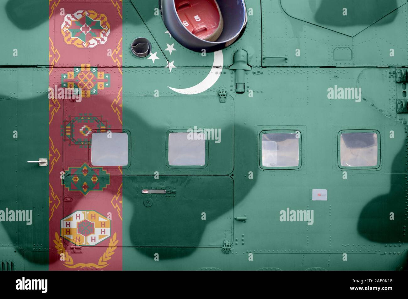 Turkmenistan flag depicted on side part of military armored helicopter ...
