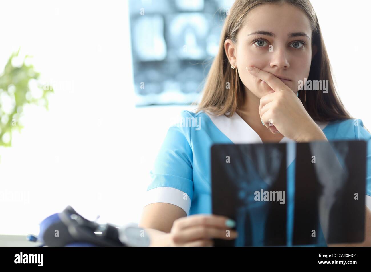 Cute therapist looking thoughtful Stock Photo - Alamy