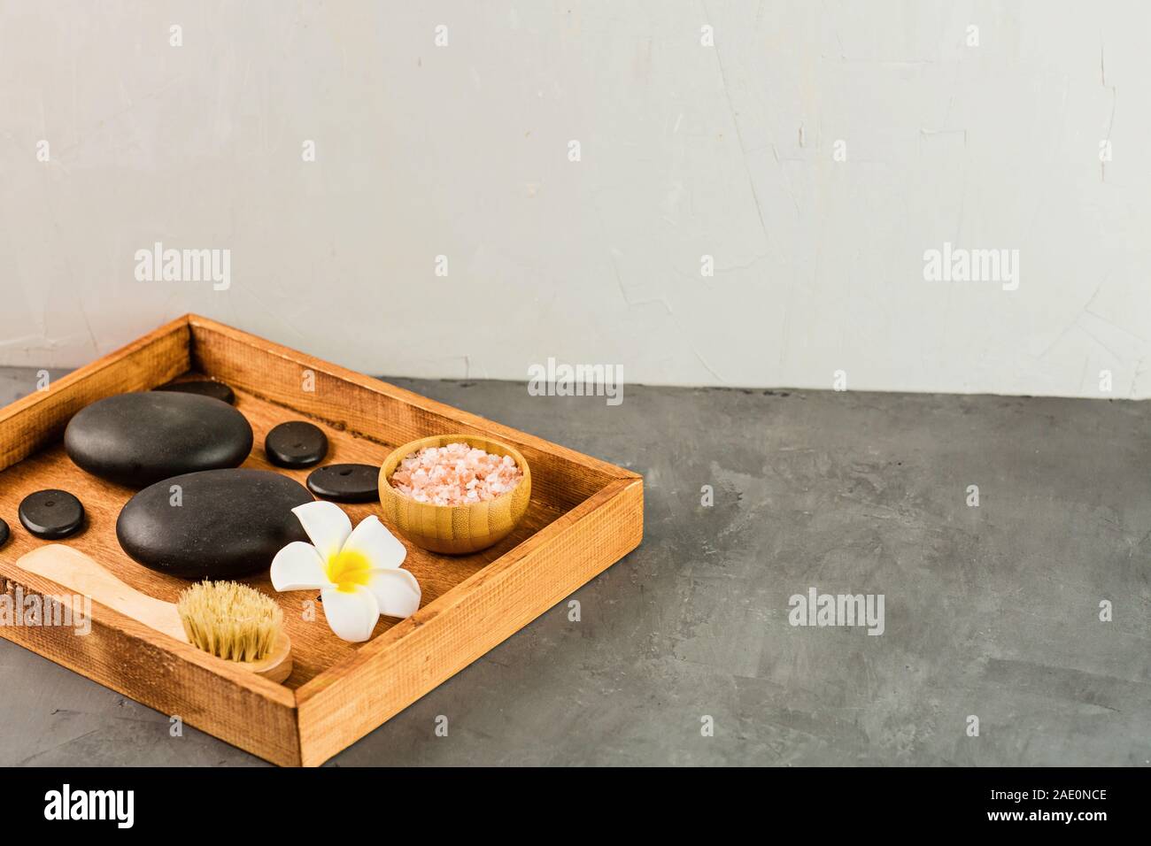 Top view of hot spa stones set for massage treatment and bamboo on ...