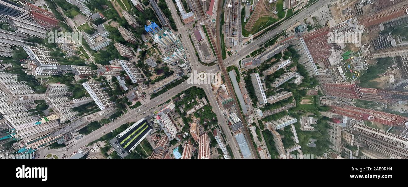 Aerial view of square in the city with roundabout traffic, streets and ...