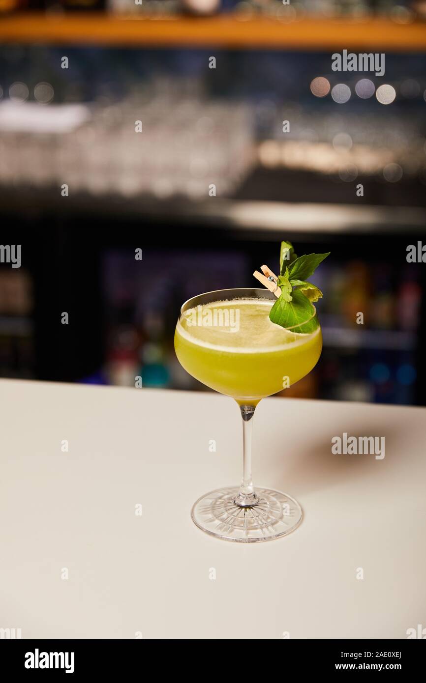 glass with mixed alcohol cocktail with gin on bar counter Stock Photo ...