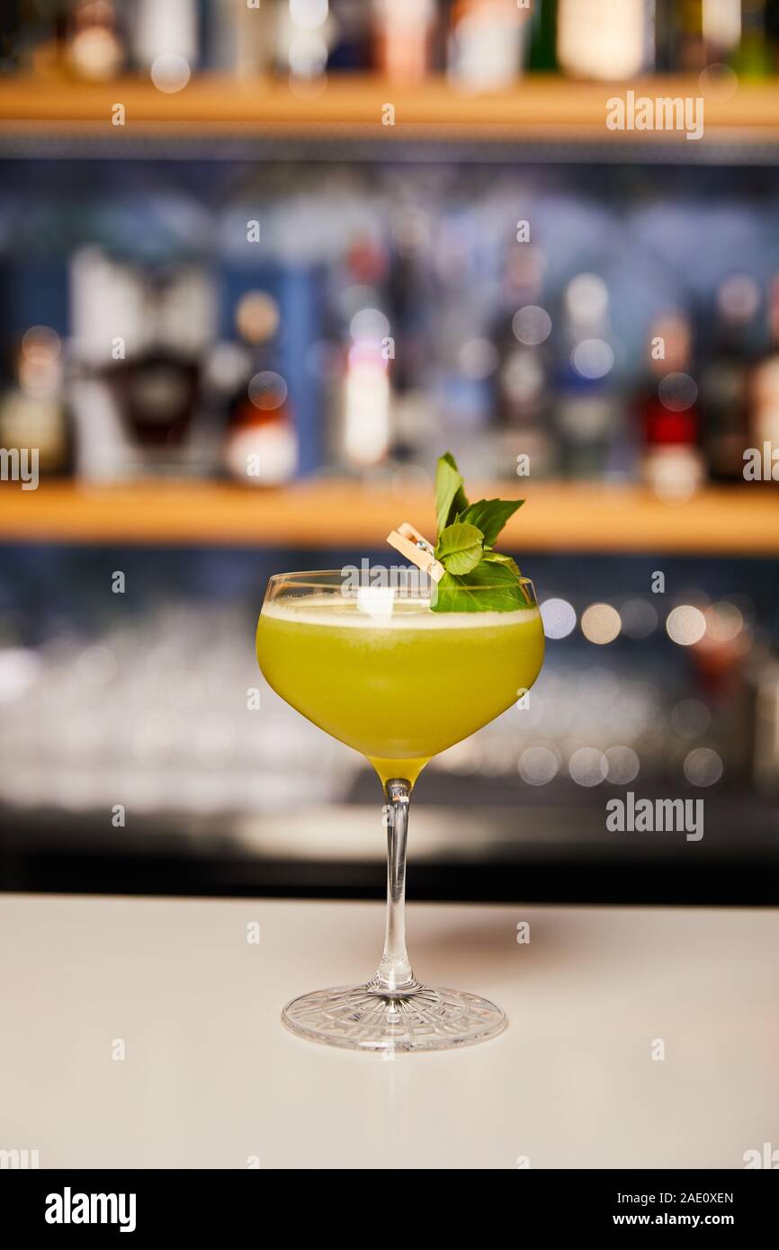 glass with fresh alcohol cocktail on bar counter Stock Photo - Alamy