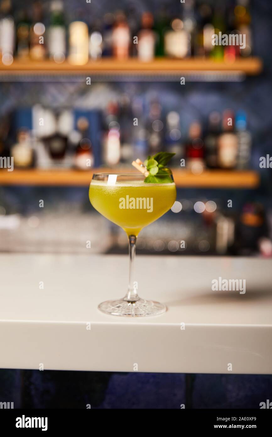 mixed alcohol cocktail in glass on bar counter Stock Photo - Alamy