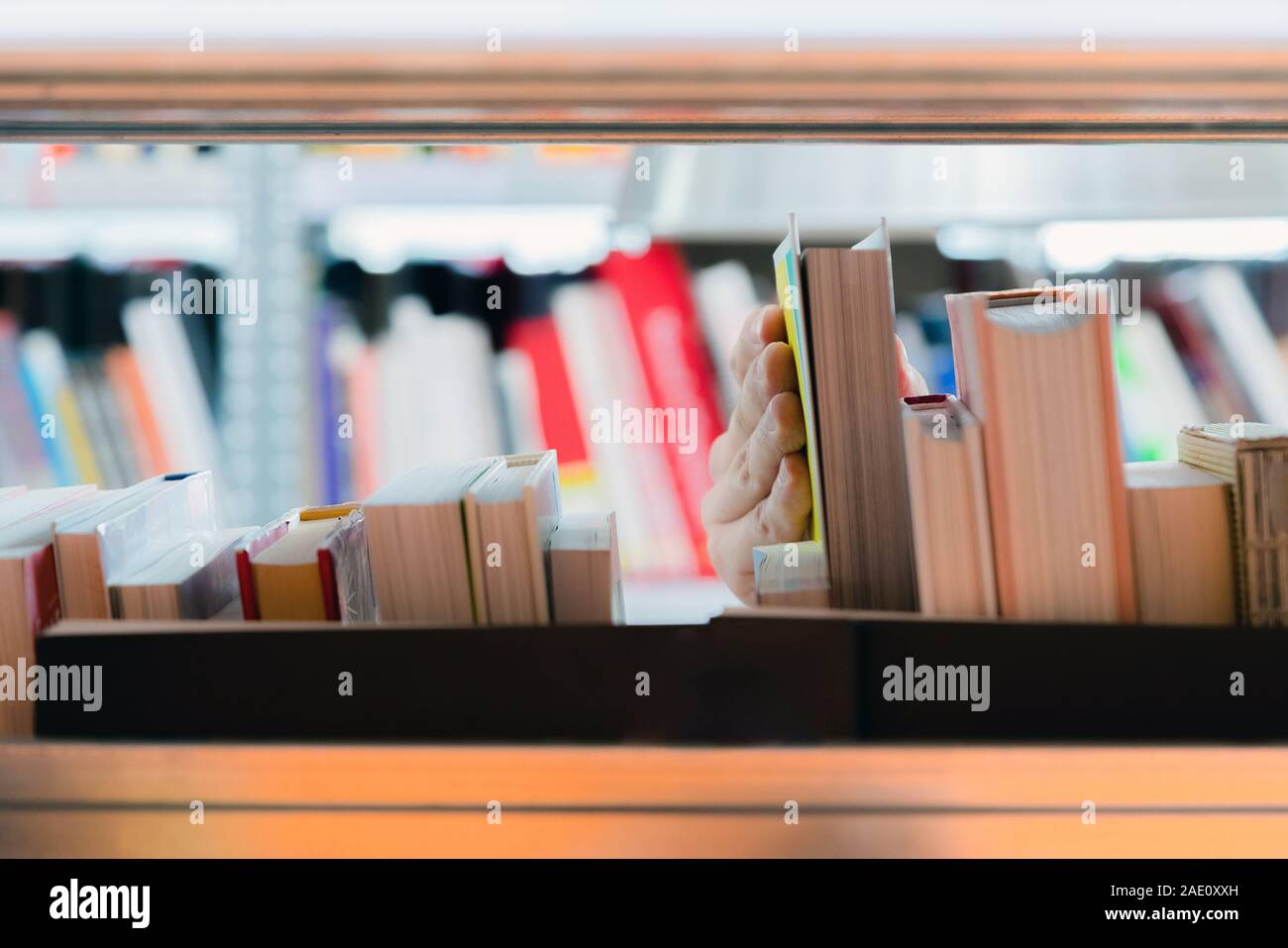 Person picking from shelf hi-res stock photography and images - Alamy