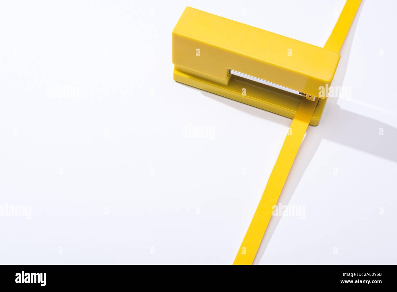 high angle view of stapler and paper strip on white background Stock ...
