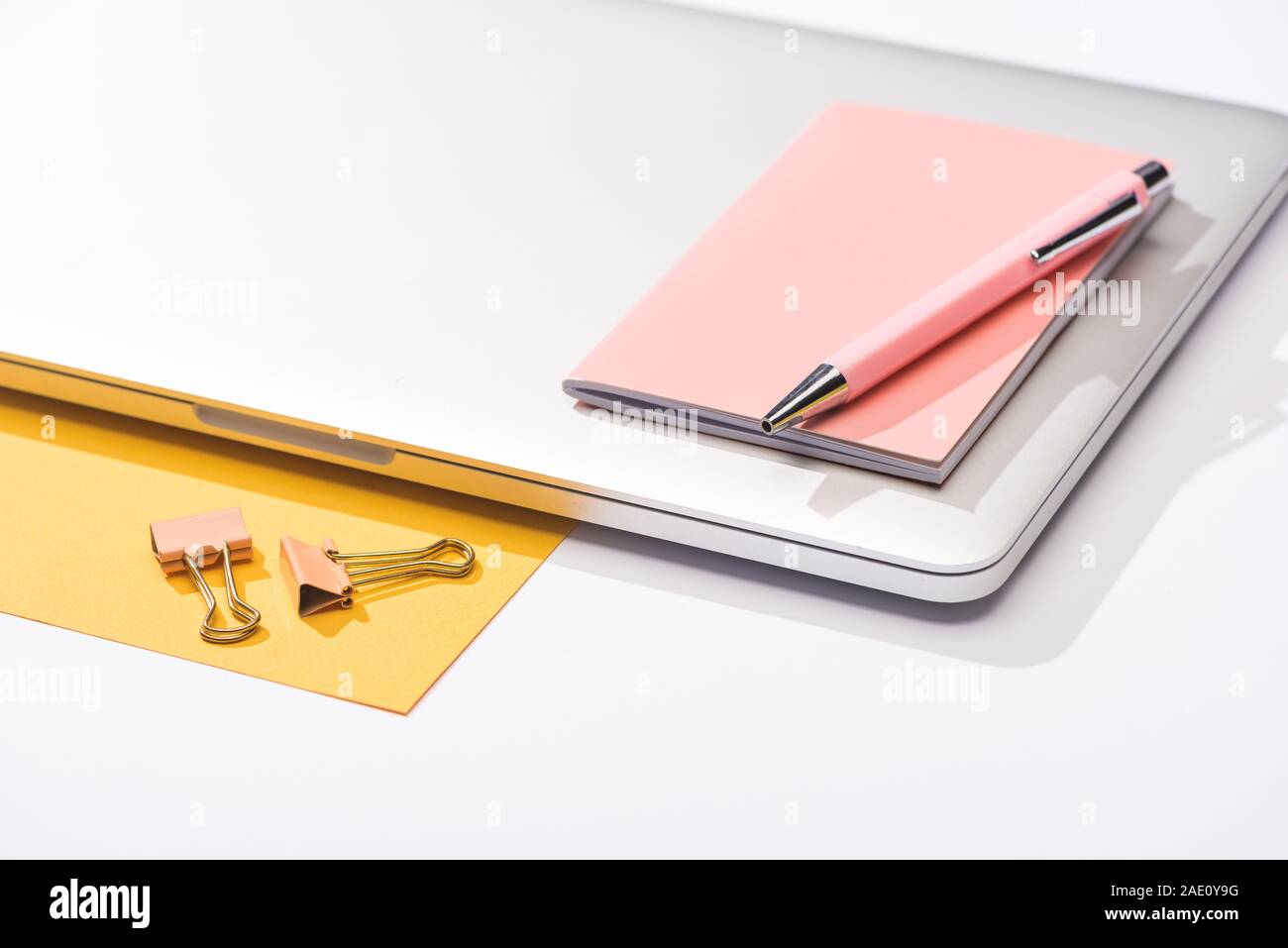 high angle view of laptop, paper, notebook, pen and paper clips Stock ...