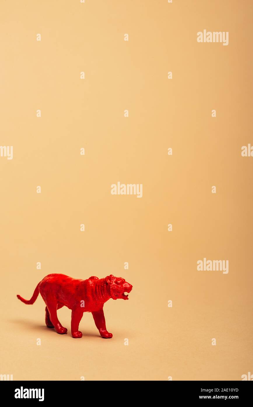 Red toy tiger on yellow background, animal welfare concept Stock Photo ...