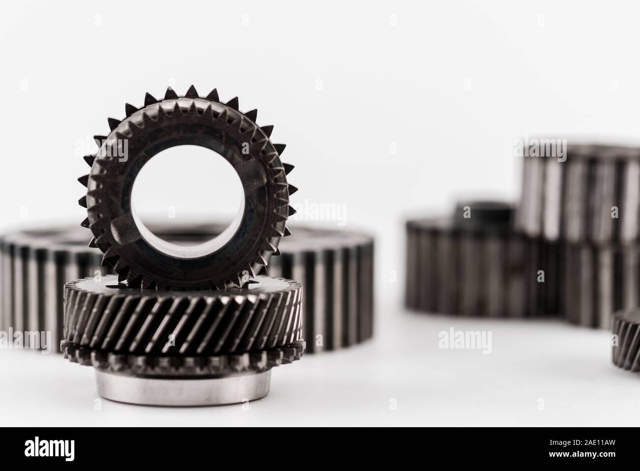 selective focus of metal round gears on white background Stock Photo ...