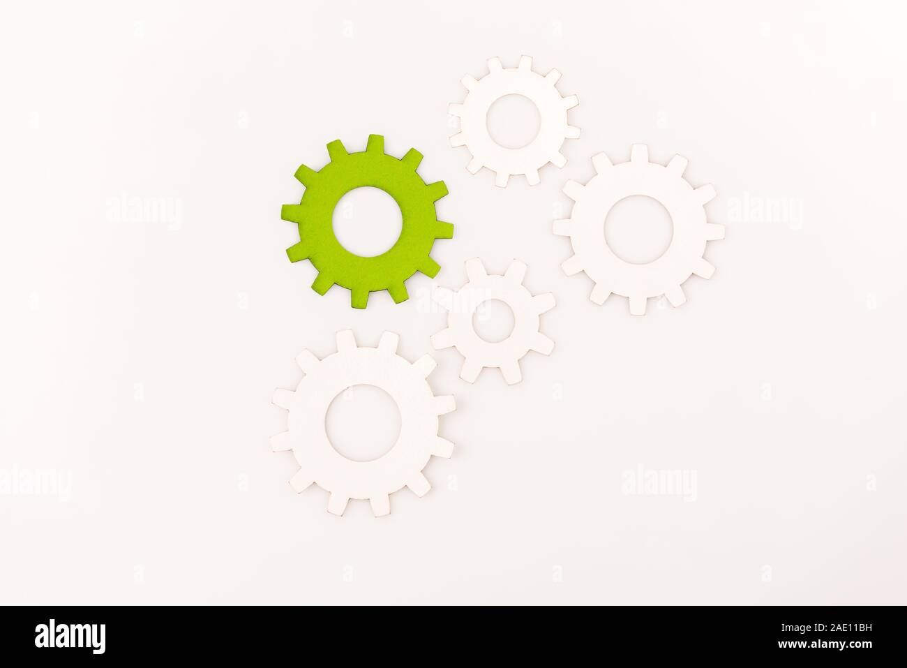top view of one green gear among another isolated on white Stock Photo ...