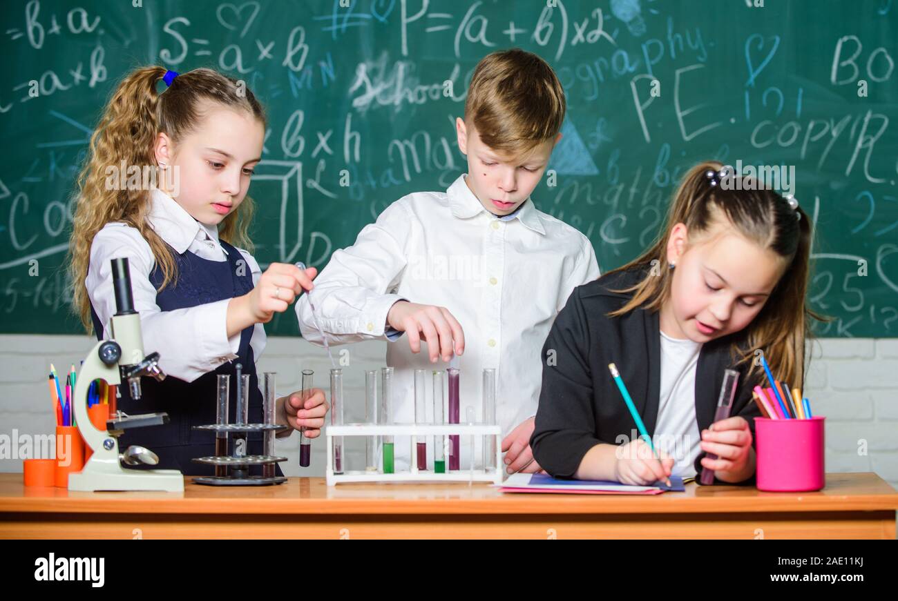 Little children. Science. Little kids earning chemistry in school lab ...