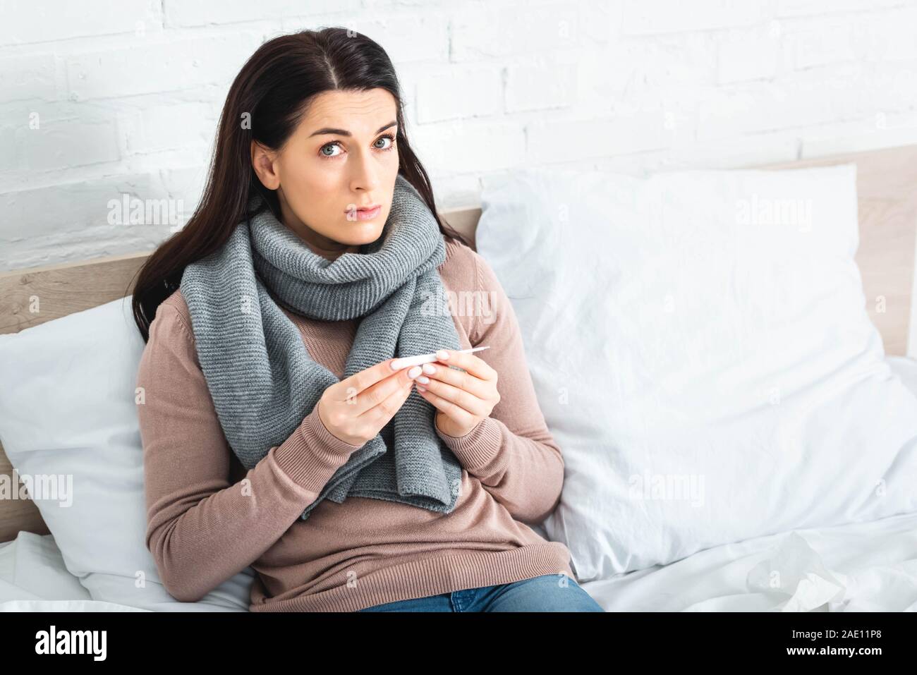 sick woman with thermometer having fever at home Stock Photo - Alamy