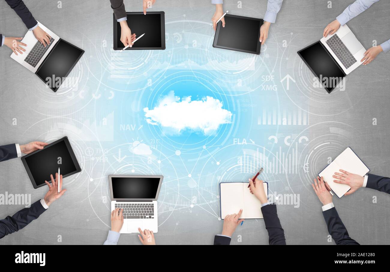 Group of people with devices in hands working on reports with online ...