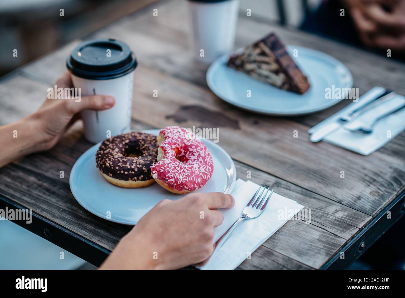 a couple is eating in a cafe delicious pastry and drink coffee Stock ...