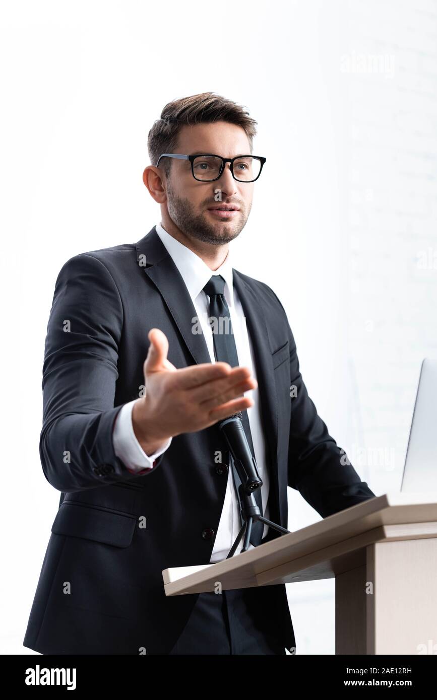 Businessman standing podium hi-res stock photography and images - Alamy