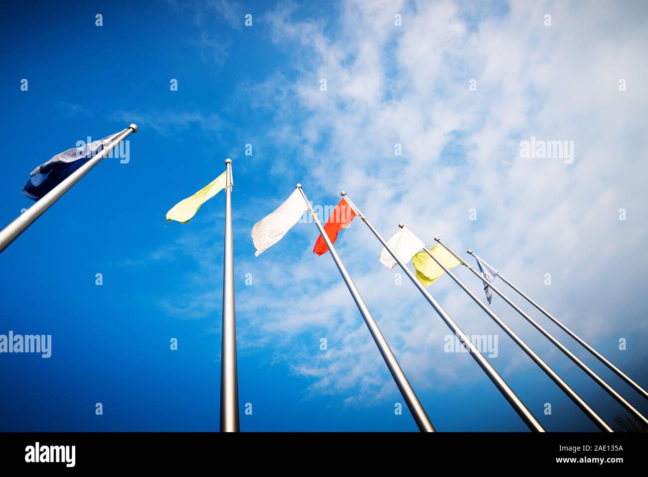 Empty white clear flag waving against clean blue sky, close up ...