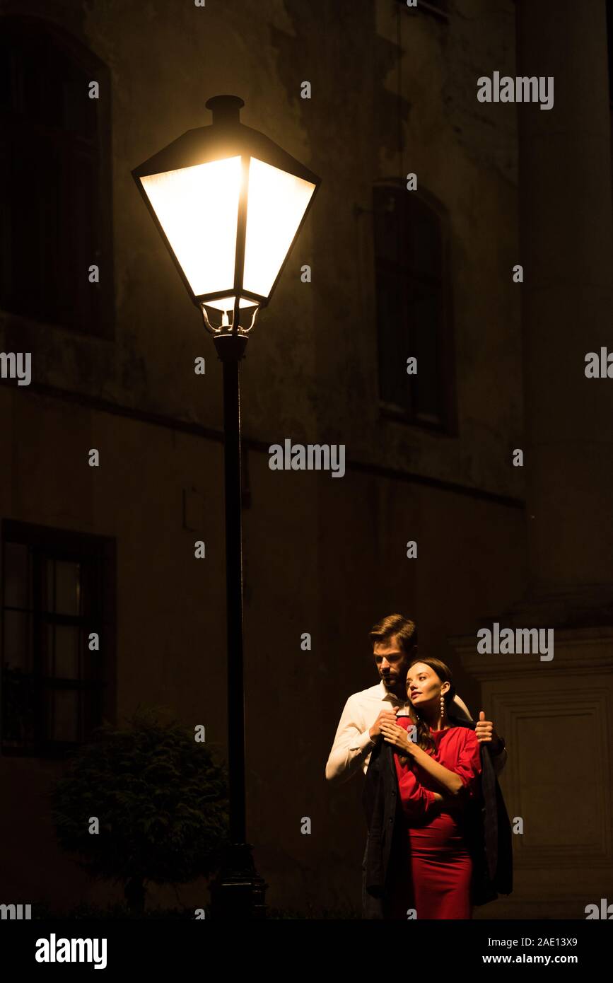 Standing under street lamp hi-res stock photography and images - Alamy