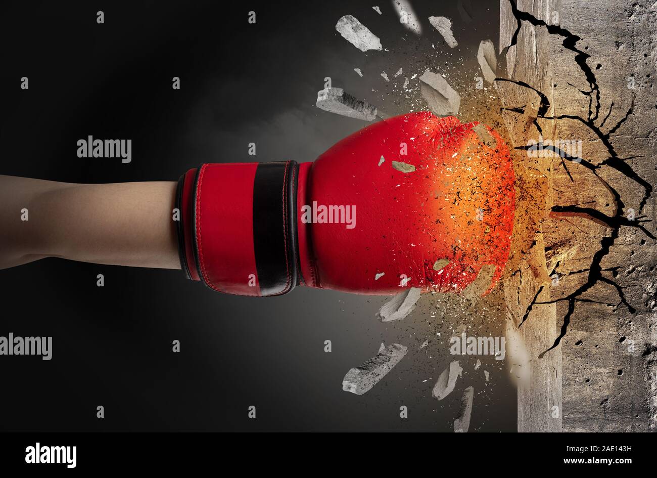 Big hand hits intense and breaks a crass stonewall Stock Photo - Alamy