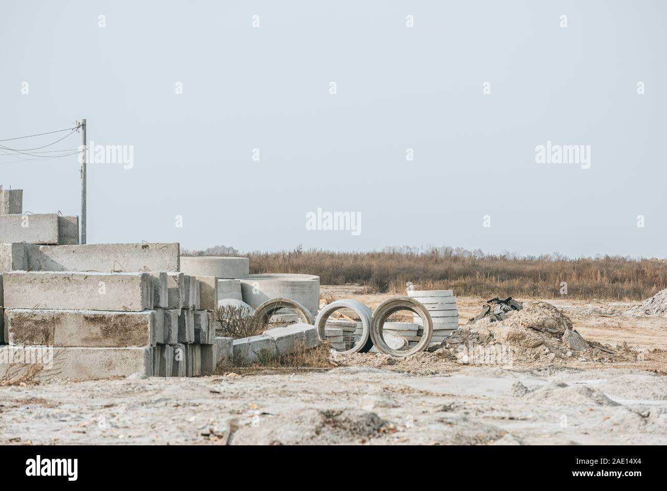 Concrete blocks and building materials in field Stock Photo - Alamy