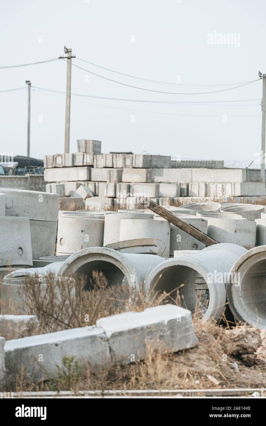 Concrete blocks and building materials on construction site Stock Photo ...