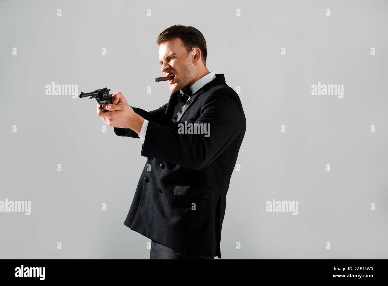 Gangster Holding Gun Stock Photo - Alamy