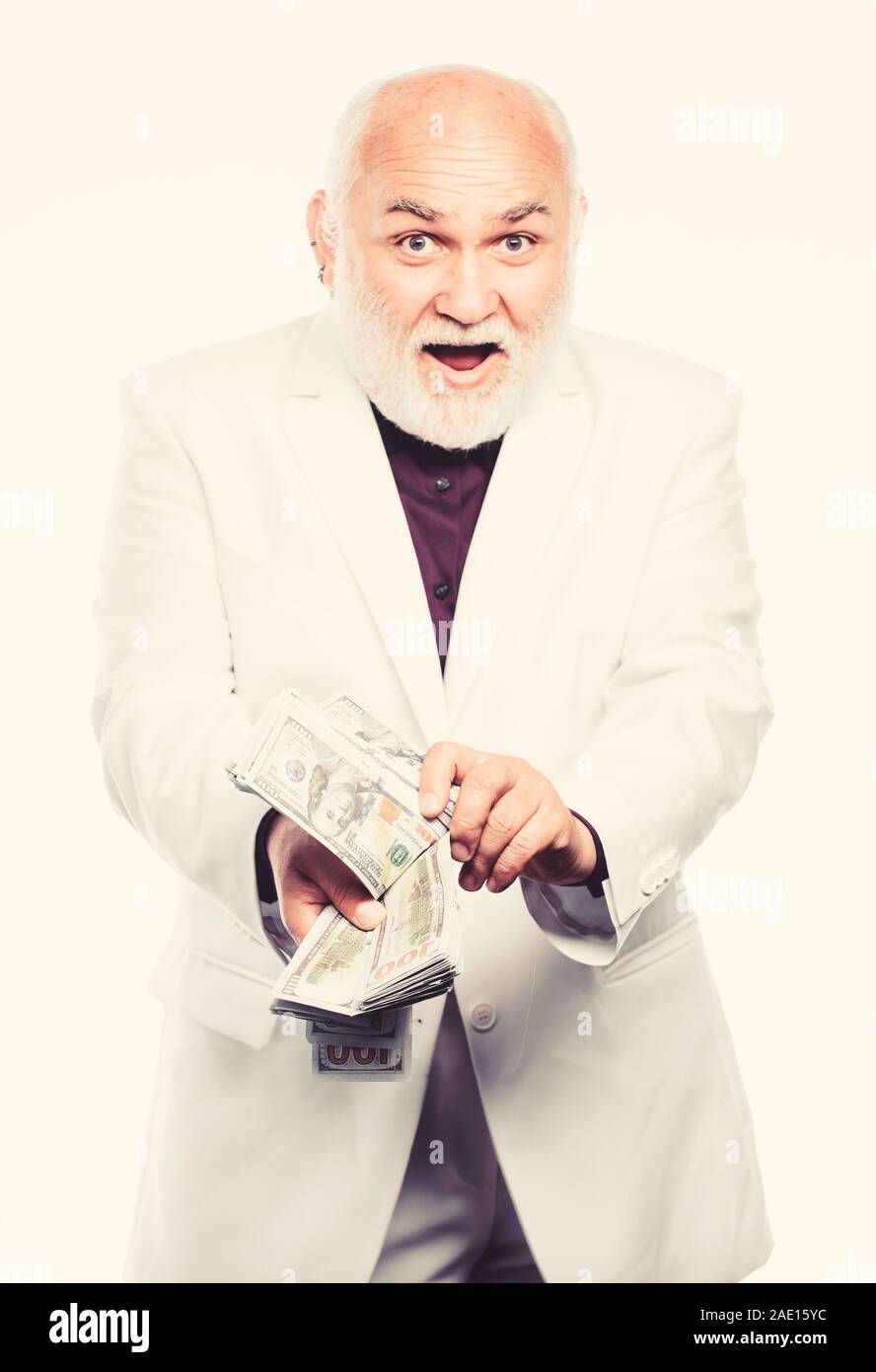 fake money. mature bearded man with dollar banknotes. successful ...