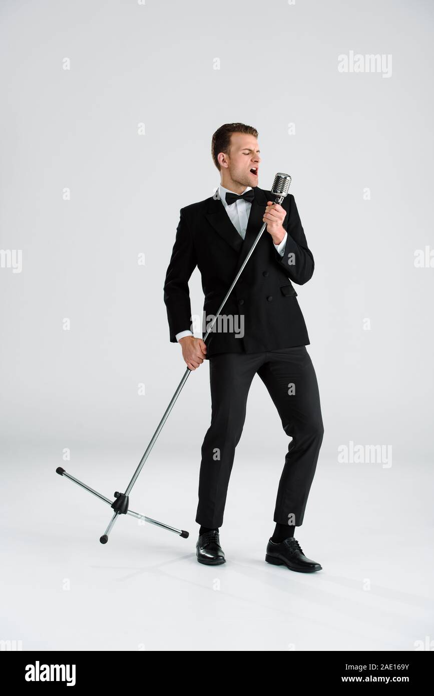 Handsome man singing touching hi-res stock photography and images - Alamy