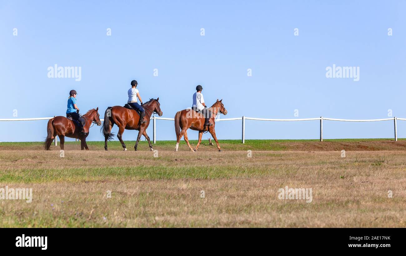 Three women riding hi-res stock photography and images - Alamy