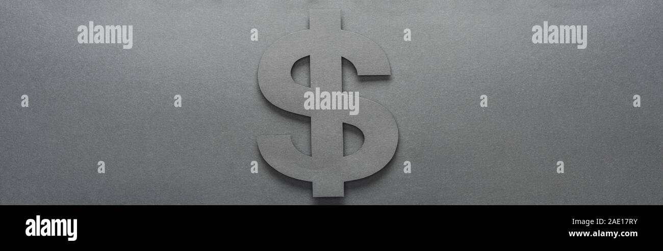 top view of dollar sign on grey background with shadow, panoramic shot ...