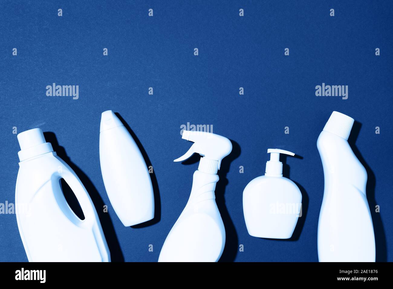 Cleaning products on classic blue background. Top view. Copy space ...