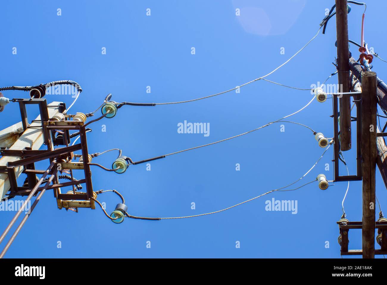 column of electrical energy against the blue sky. Electrical industry ...