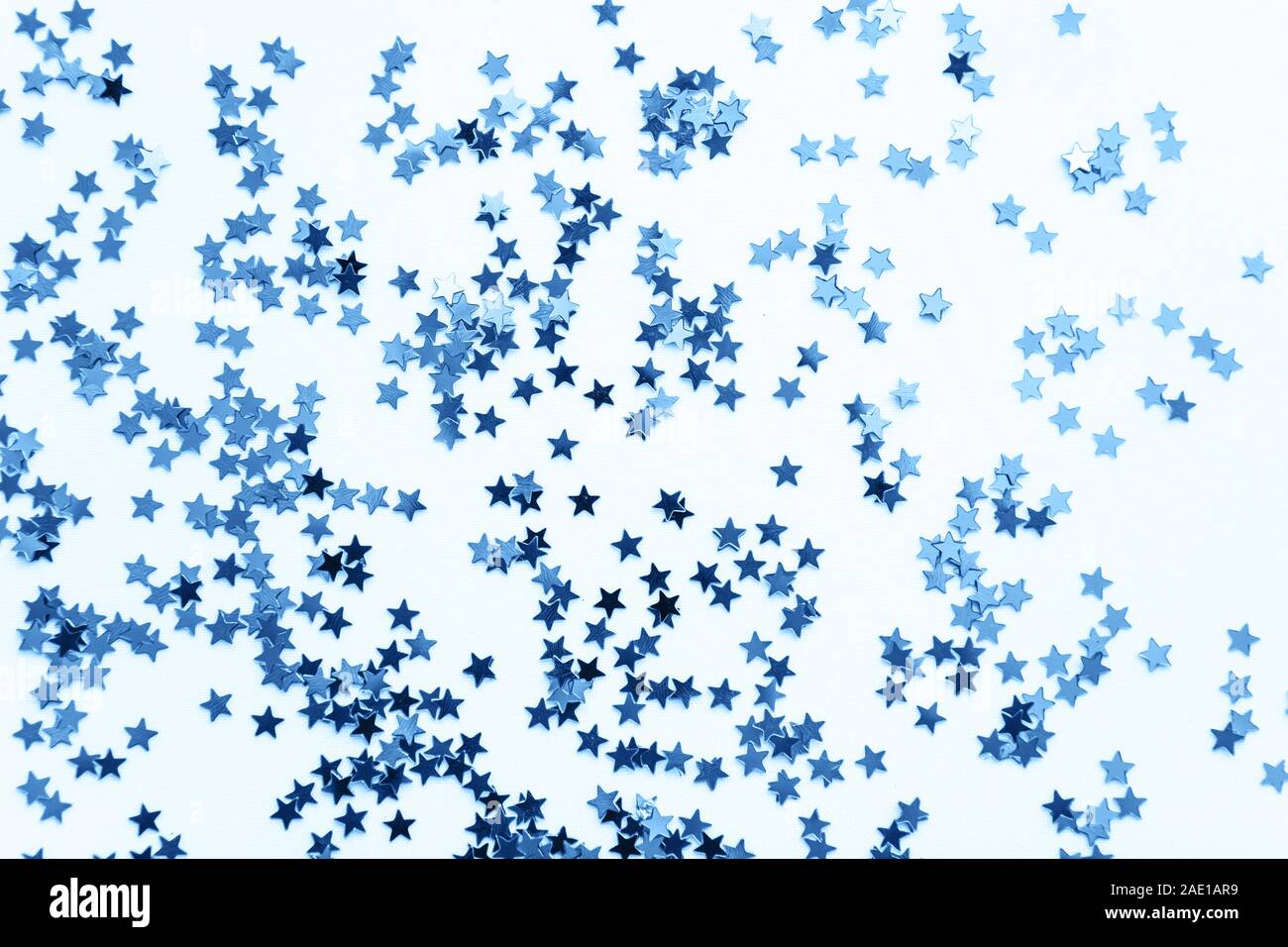 Festive in classic blue color stars of confetti on a white background ...