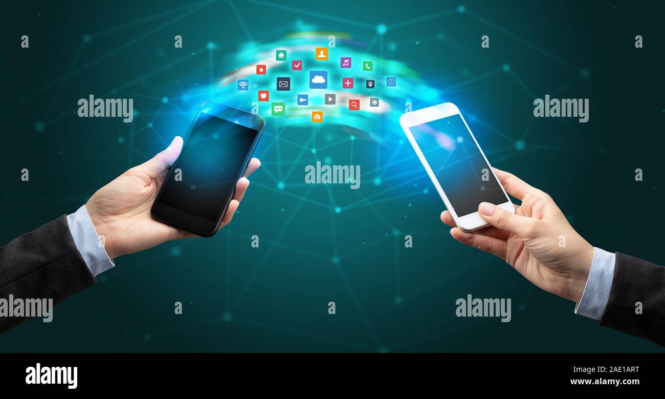 Two mobile phones syncing applications concept Stock Photo - Alamy