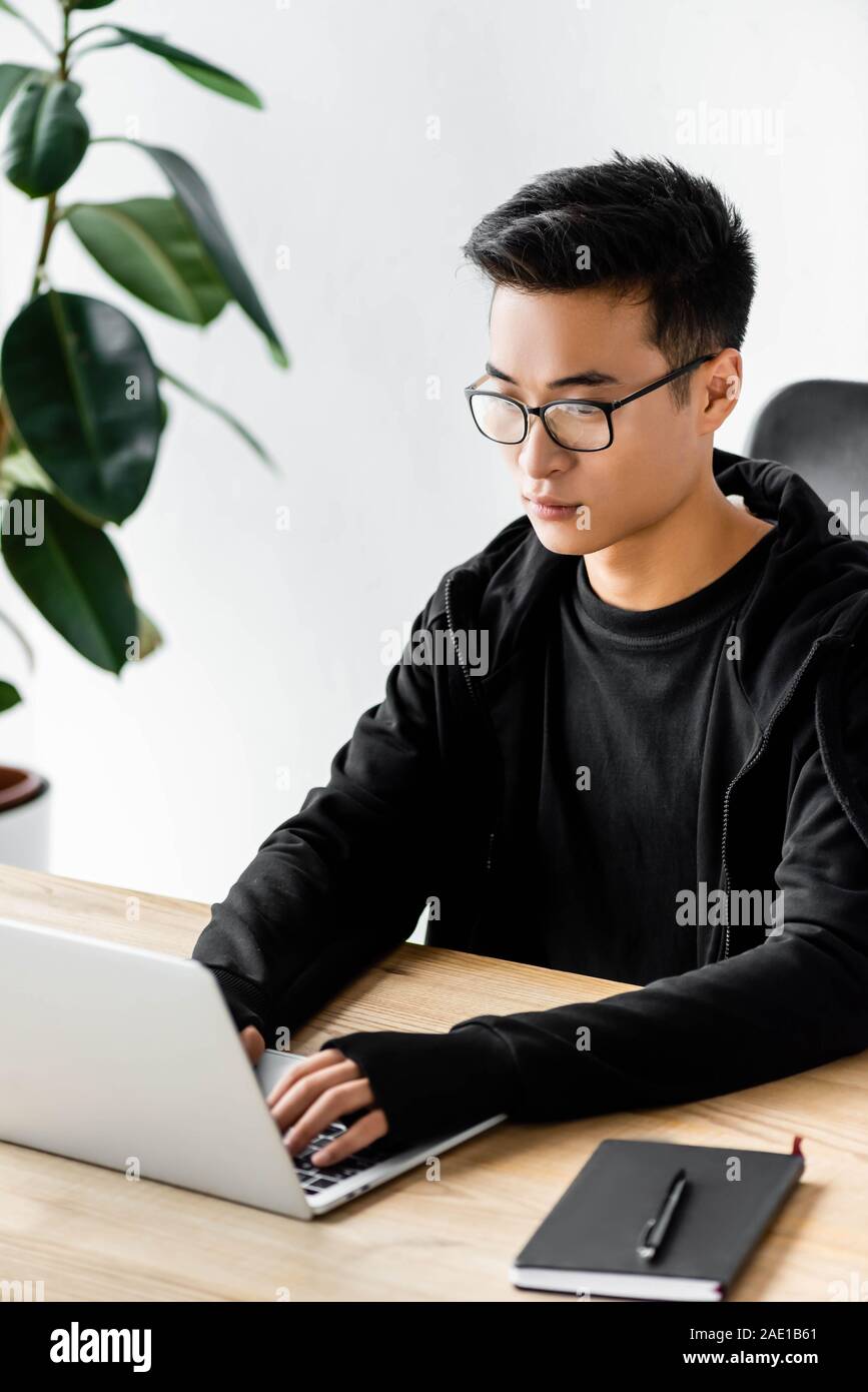 Asian hacker in glasses hi-res stock photography and images - Alamy