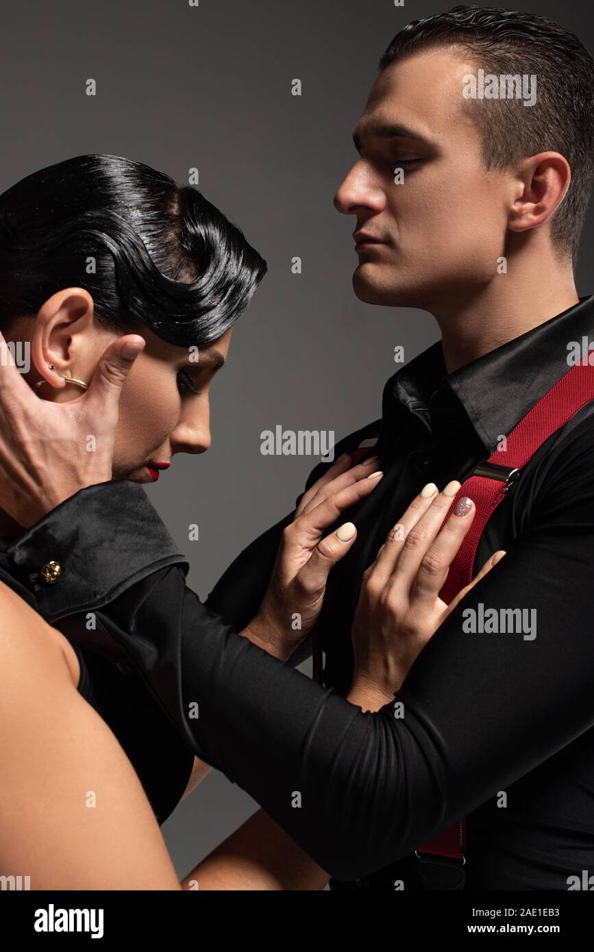 sensual dancer touching head of beautiful partner while performing ...