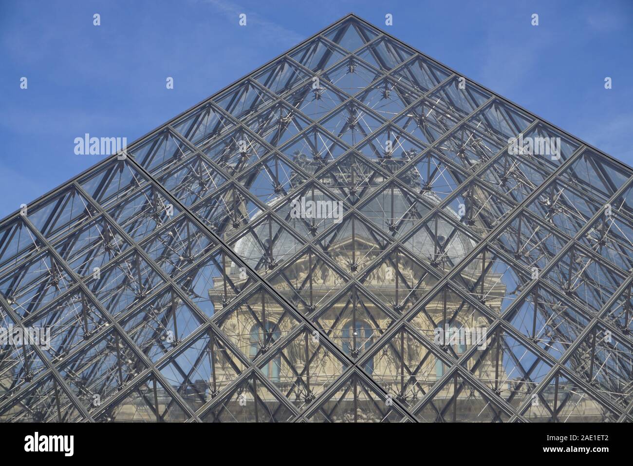 top of the glass pyramid of the Louvre, Paris with the old stone museum ...