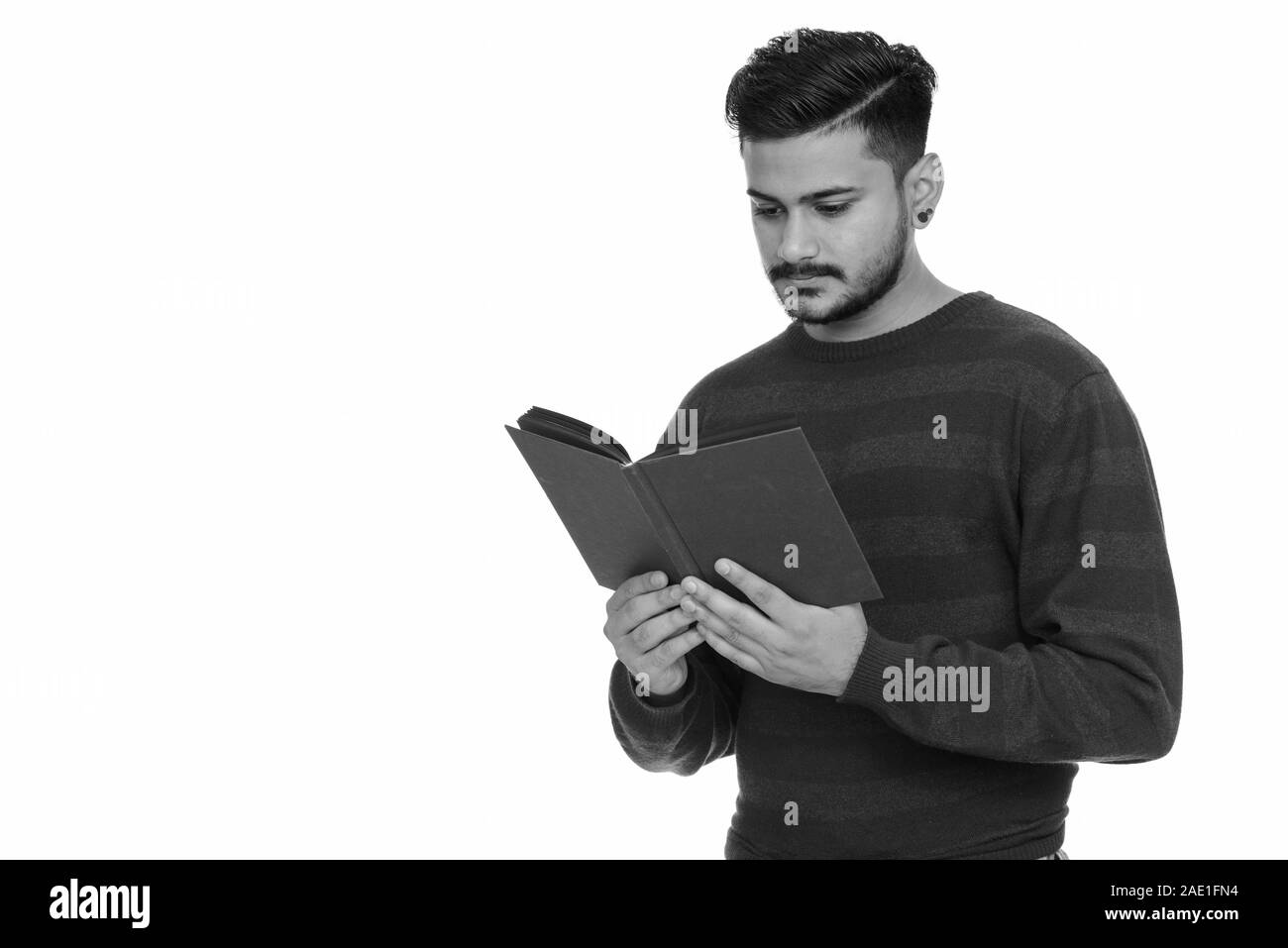 Portrait indian young man reading Cut Out Stock Images & Pictures - Alamy