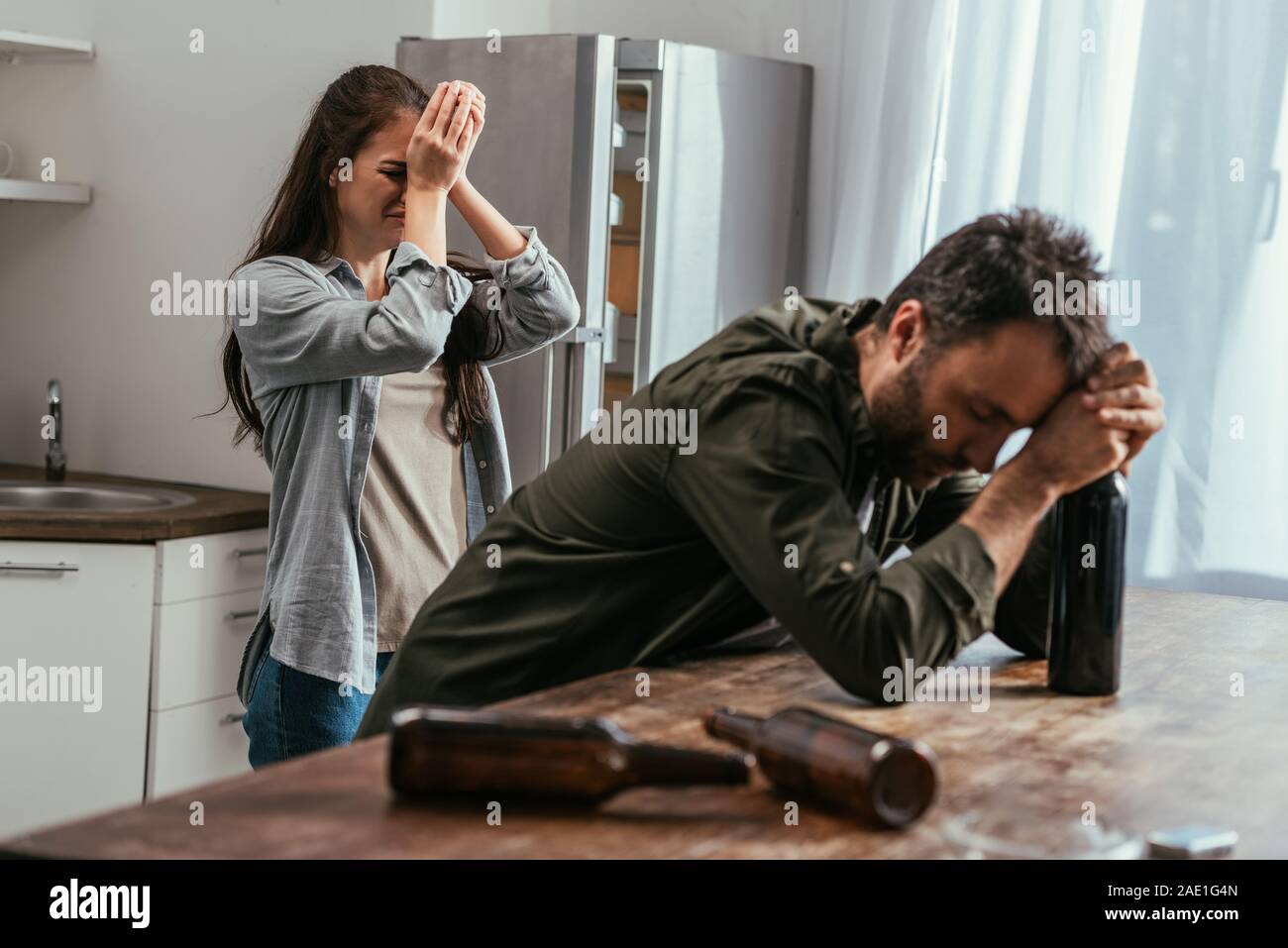 Alcohol woman crying man hi-res stock photography and images - Alamy