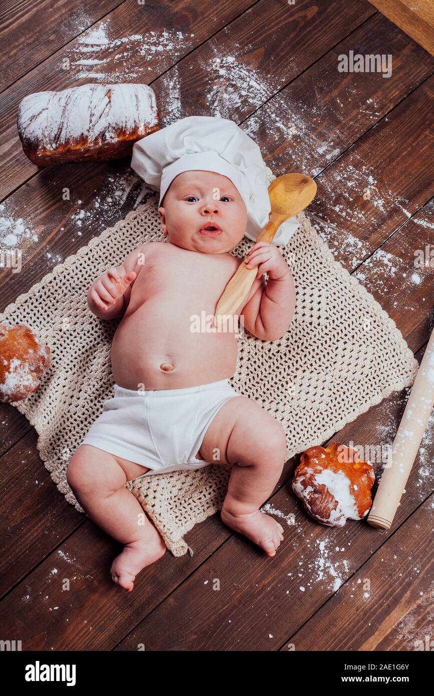 the baby in the head cook flour buns bread Stock Photo - Alamy
