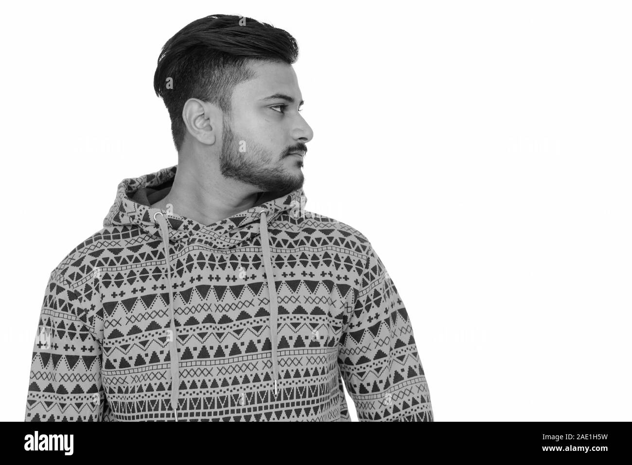 Side view of young handsome Indian man with body facing camera Stock ...