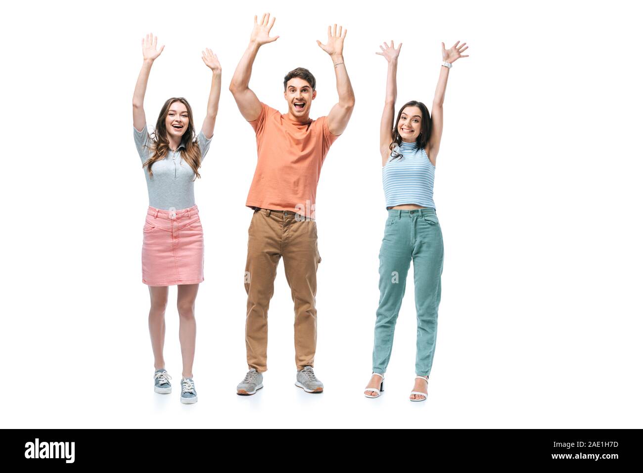positive friends standing together with hands up, isolated on white ...